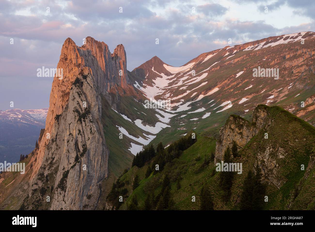 The Saxer Gap in the Swiss Alps is lit up by the sun on a morning Stock ...