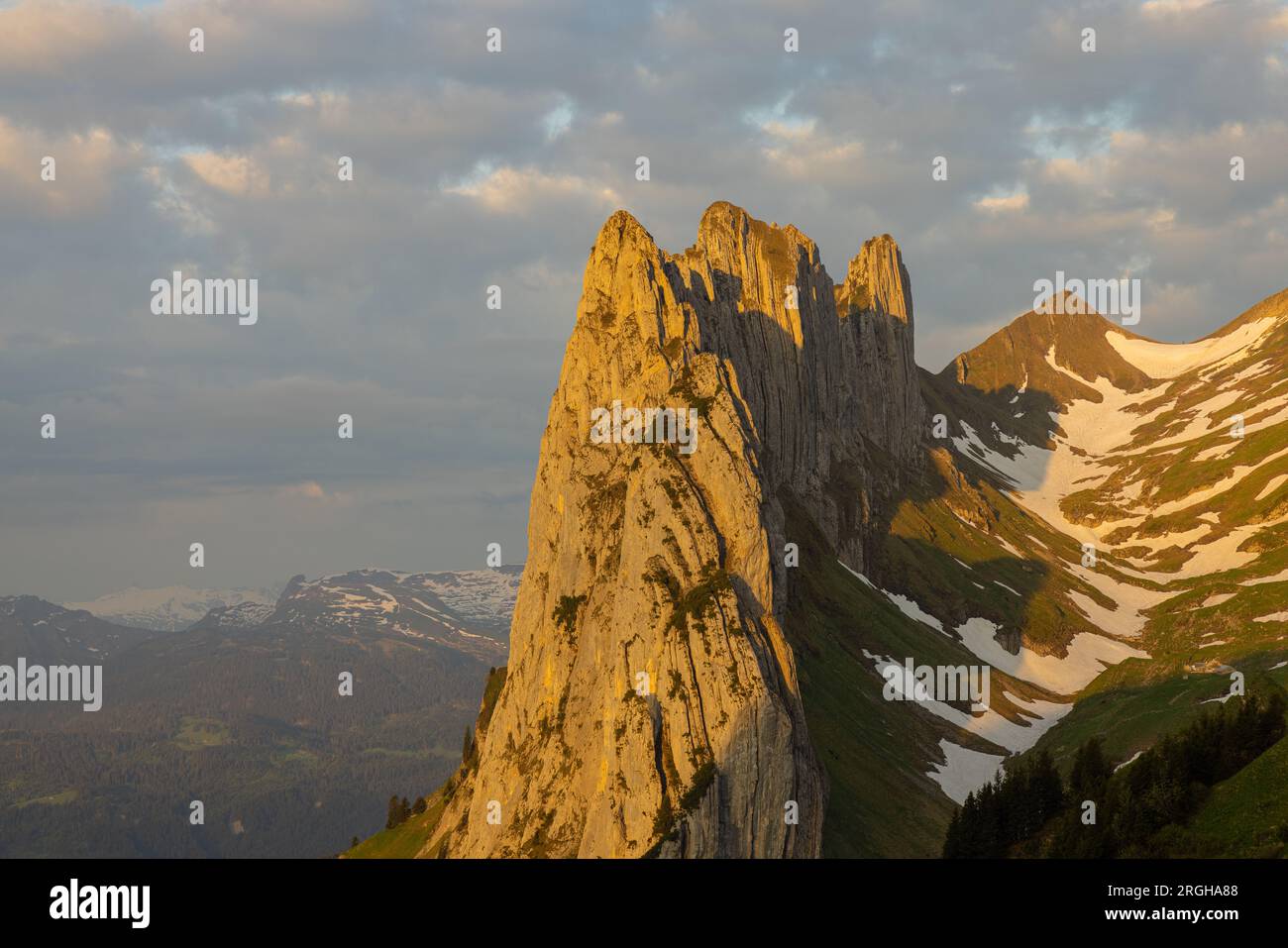 The Saxer Gap in the Swiss Alps is lit up by the sun on a morning Stock ...