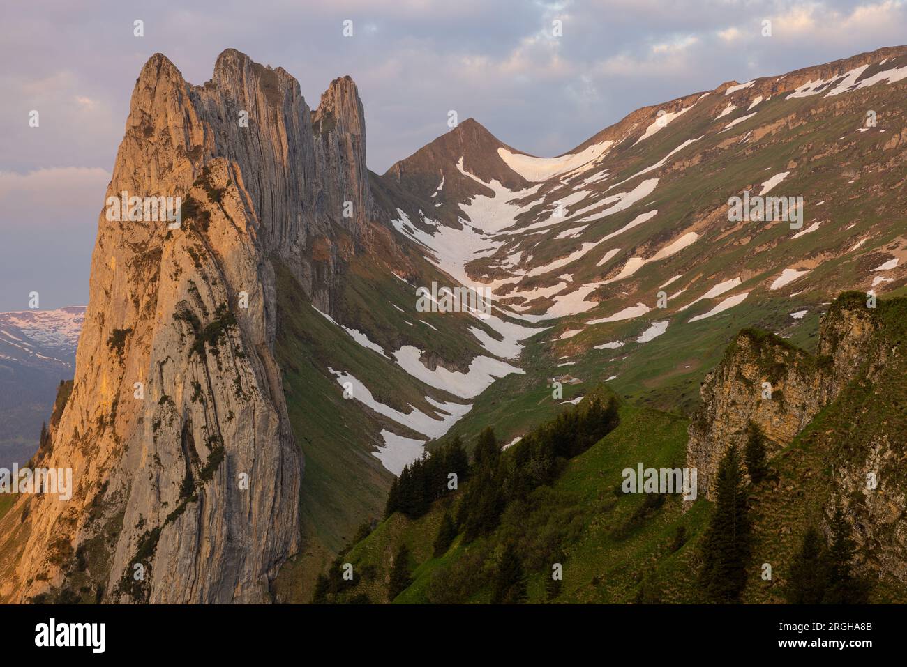 The Saxer Gap in the Swiss Alps is lit up by the sun on a morning Stock ...