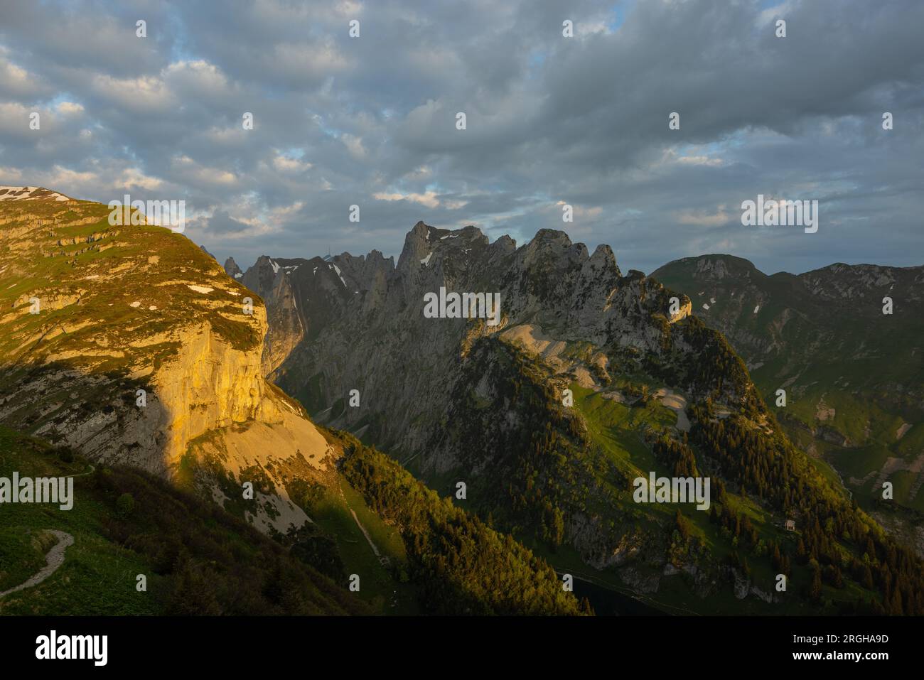 The Saxer Gap in the Swiss Alps is lit up by the sun on a morning Stock ...