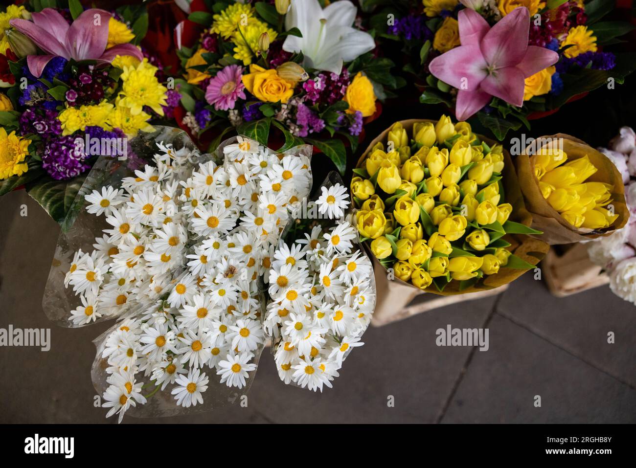 Large bouquets of colorful flowers wrapped up at a grab and go outdoor ...