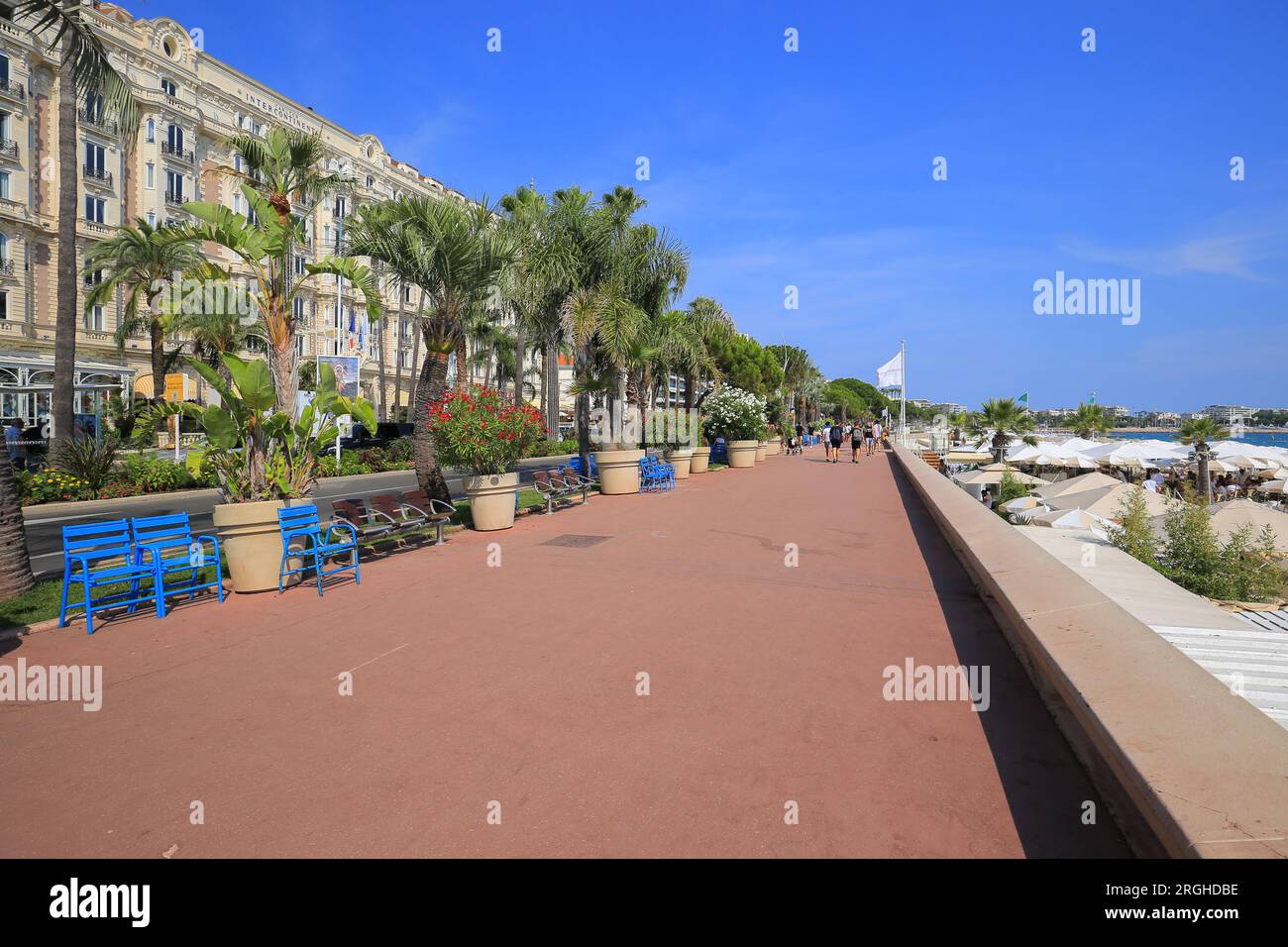 Promenade with blue chairs in Cannes Stock Photo - Alamy