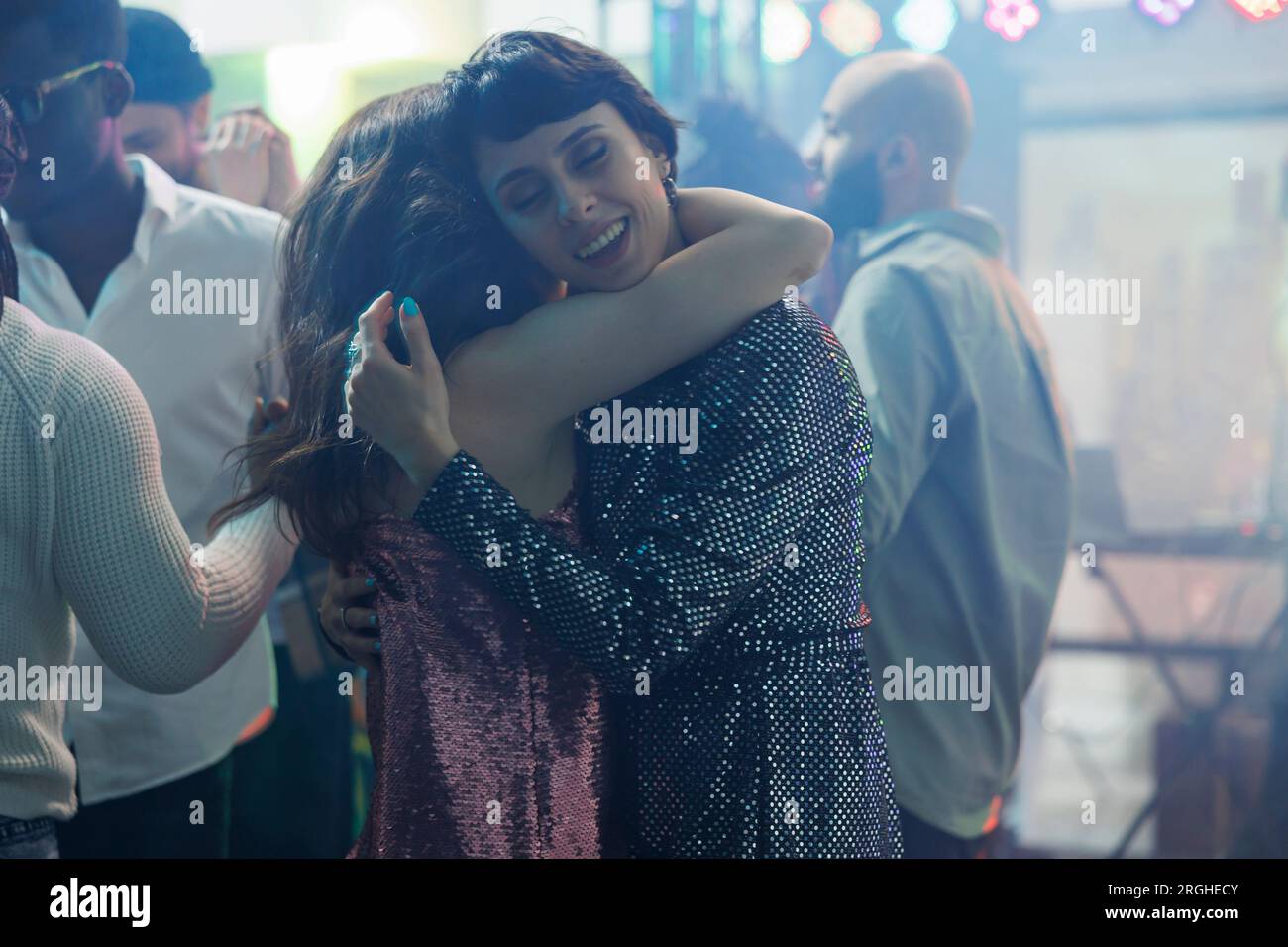 Couple hugging in nightclub hi-res stock photography and images - Alamy