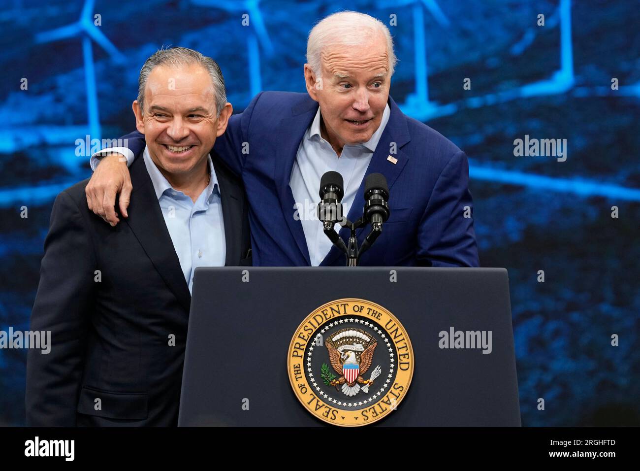 President Joe Biden, right, puts his arm around Arcosa CEO Antonio Carrillo after being ...