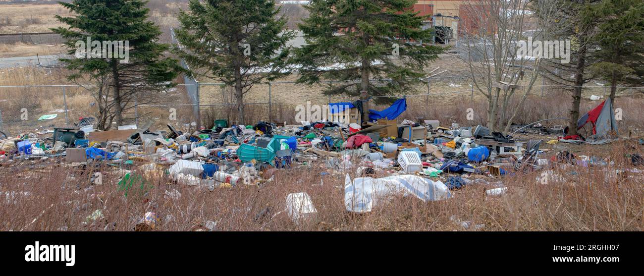 Saint John, NB, Canada - March 19, 2023: Debris and garbage litter a ...