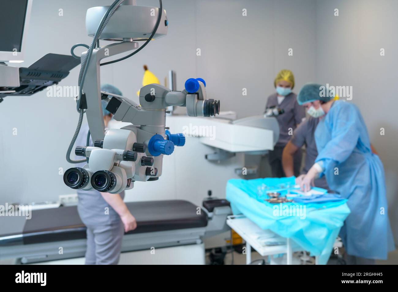 Surgical microscope in operating room with doctors. Ophthalmological ...