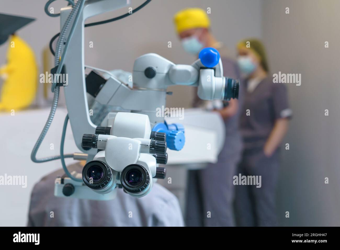 Surgical microscope in operating room with doctors. Ophthalmological ...