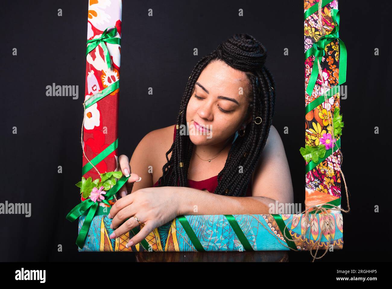 Beautiful woman with braids in her hair inside a frame adorned with ...
