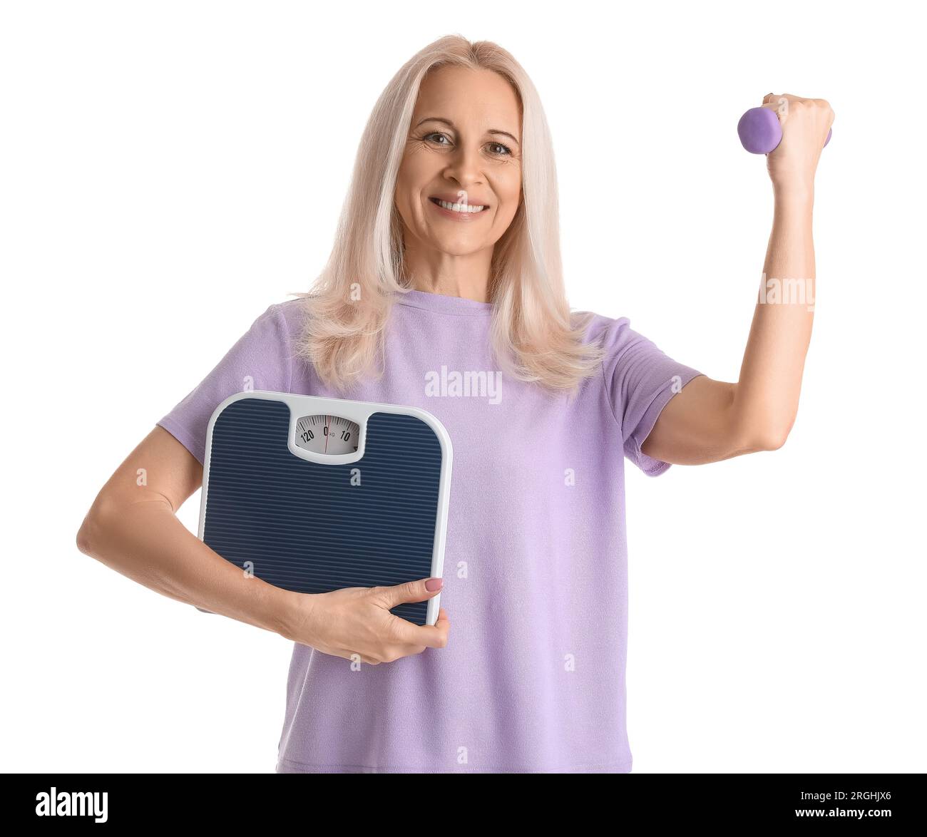 Mature woman with scales and dumbbell on white background Stock Photo ...