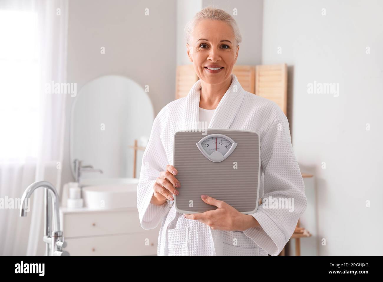 Mature sport woman measure hi-res stock photography and images - Alamy
