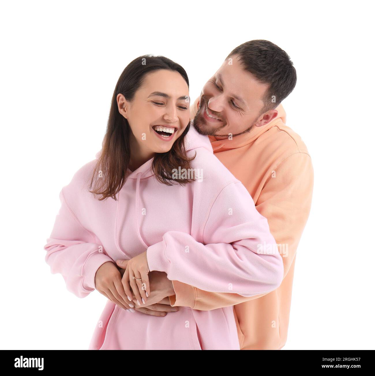 Happy engaged couple hugging on white background Stock Photo - Alamy