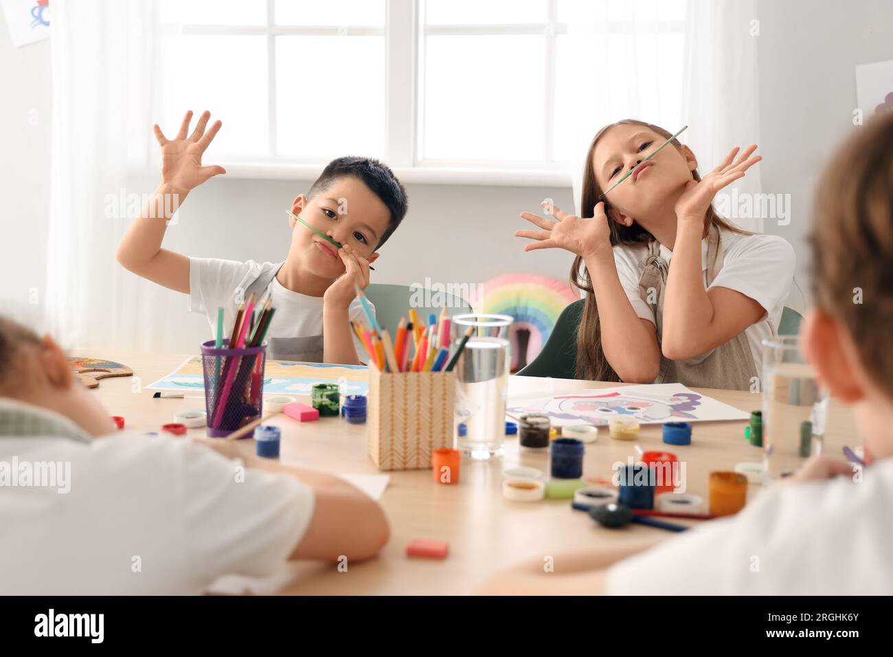Little pupils having fun in art class Stock Photo - Alamy