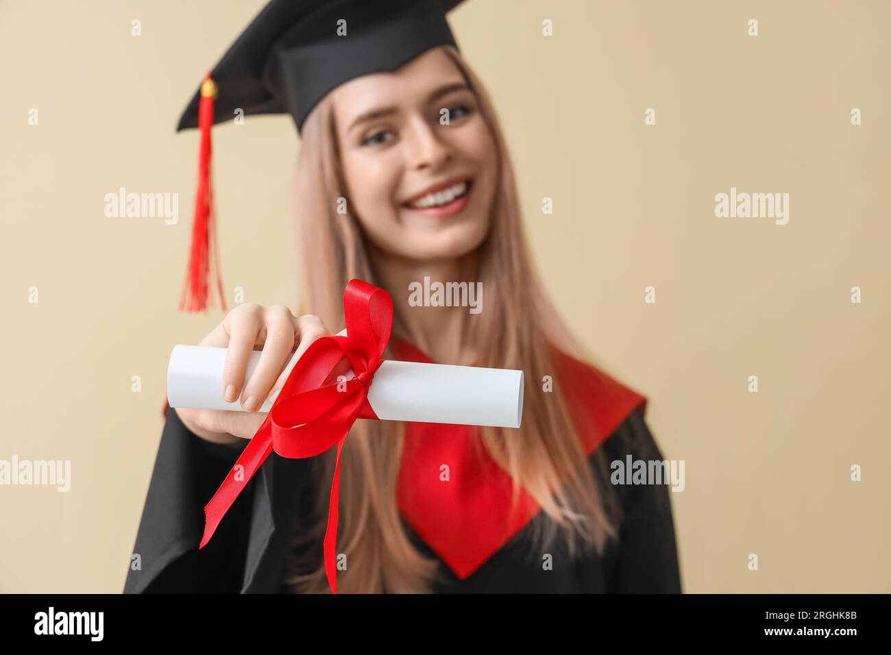 Female graduate student with diploma on beige background, closeup Stock ...