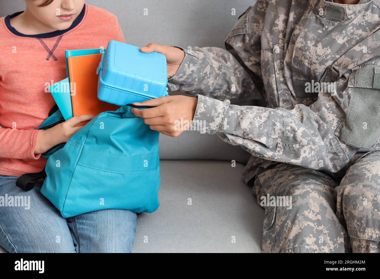 Soldier helping boy hi-res stock photography and images - Alamy