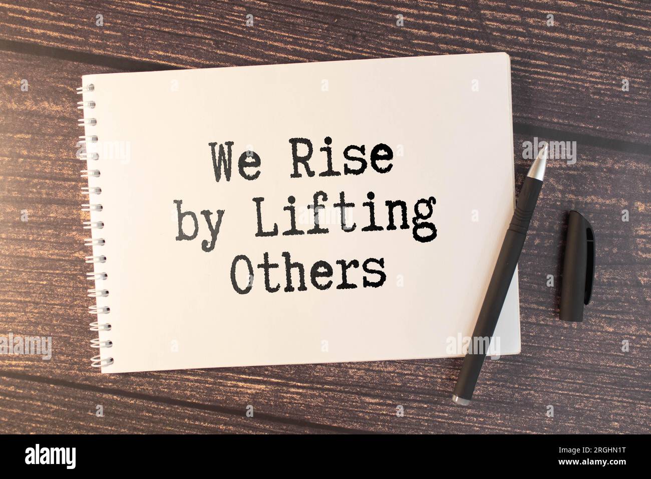 We rise by lifting others hi-res stock photography and images - Alamy