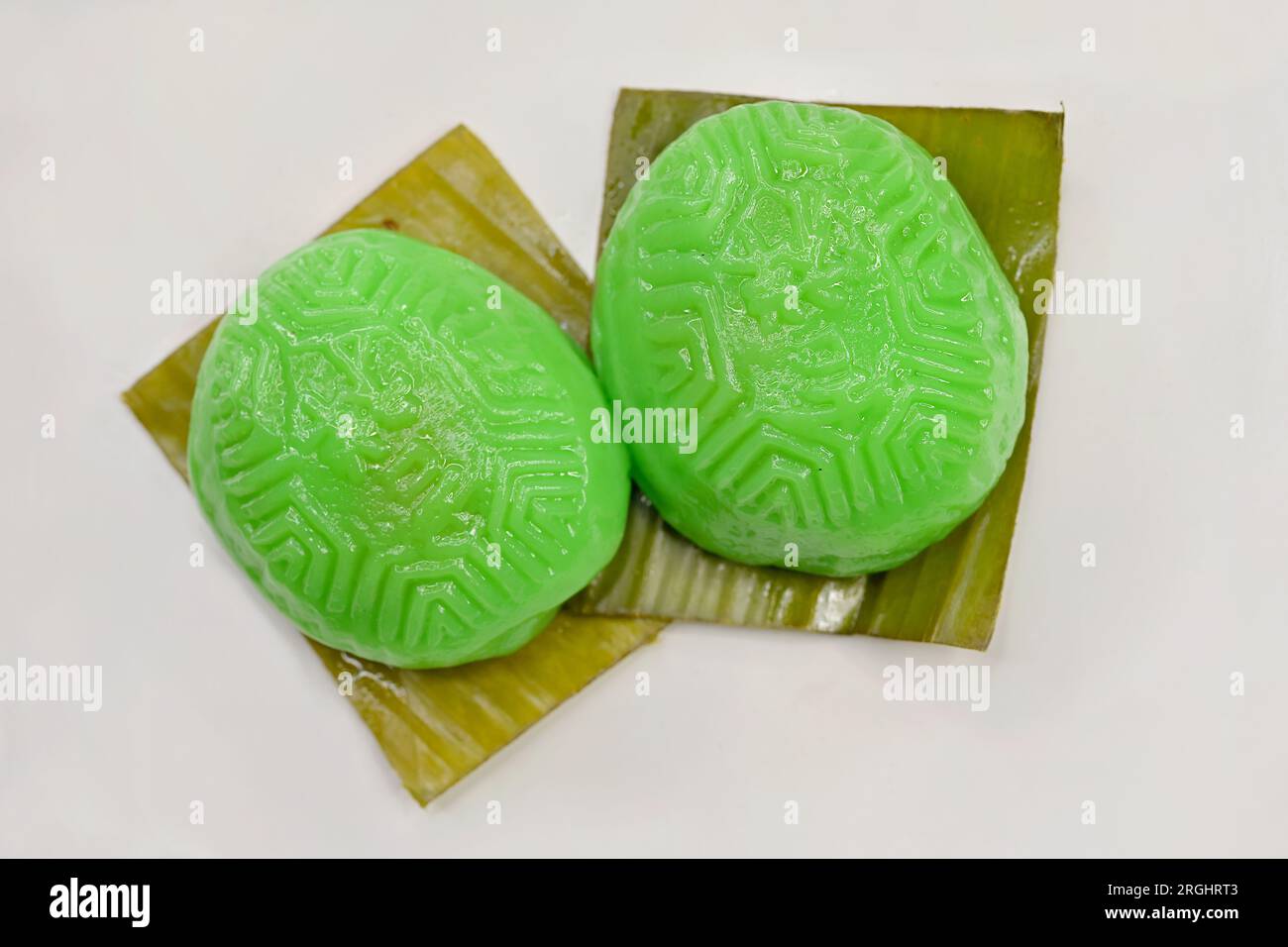 Top view of 2 steamed tortoise cakes with green skin or Ang Ku Kueh ...
