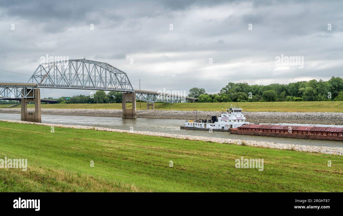 Towboat with barges is passing under a bridge on the Chain of Rocks ...
