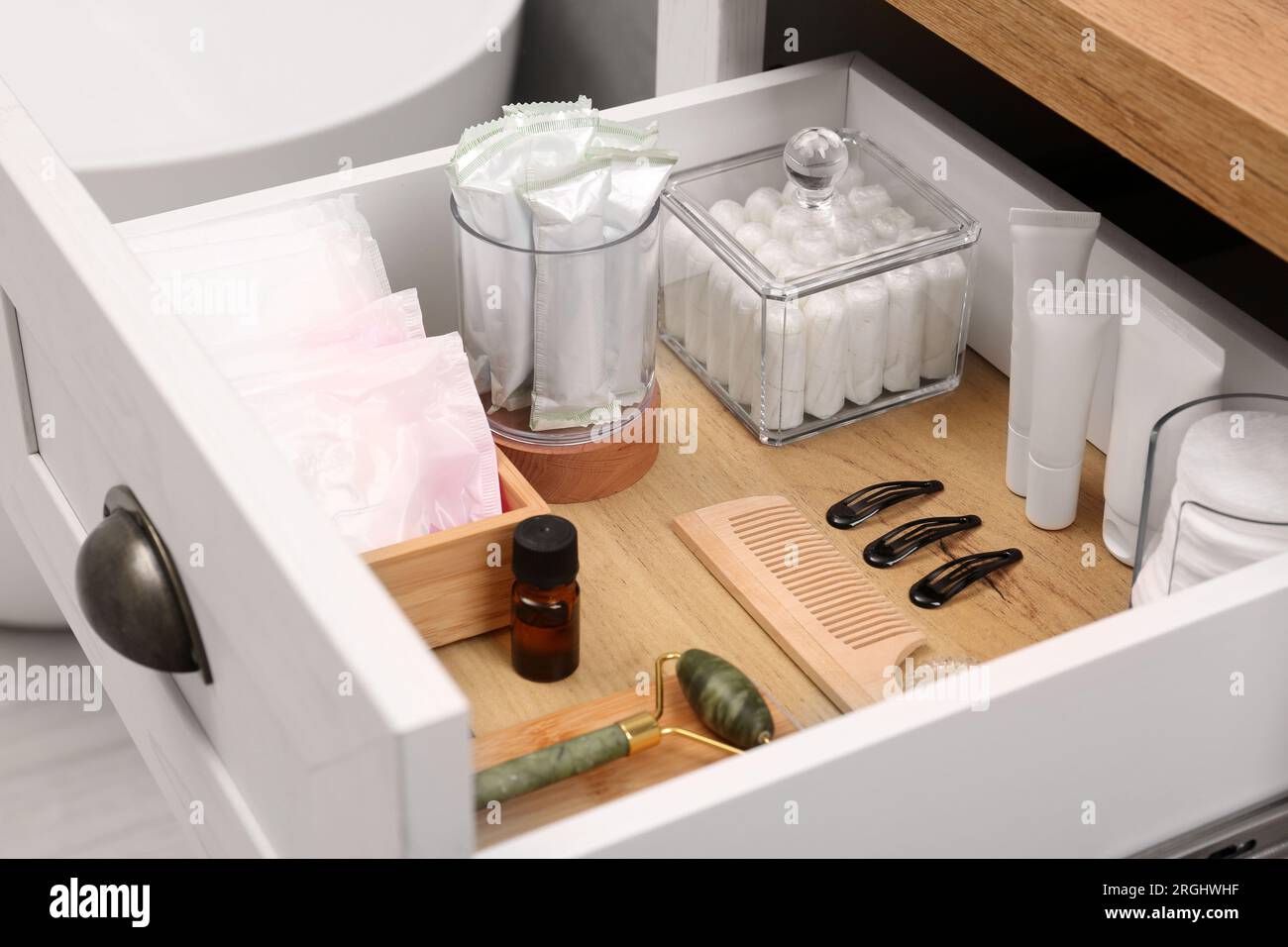 Open cabinet drawer with tampons and feminine hygiene products Stock ...