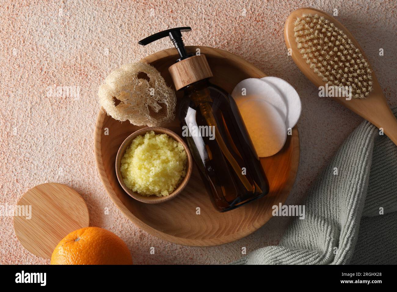 Flat lay composition with natural body scrub on beige textured table ...
