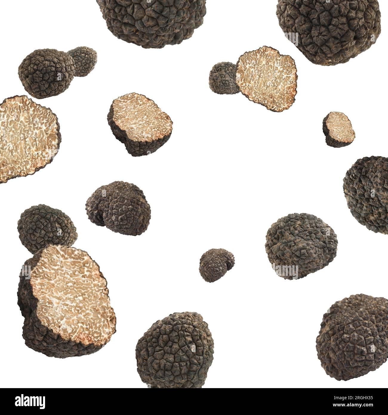 Cut and whole truffles falling on white background Stock Photo - Alamy
