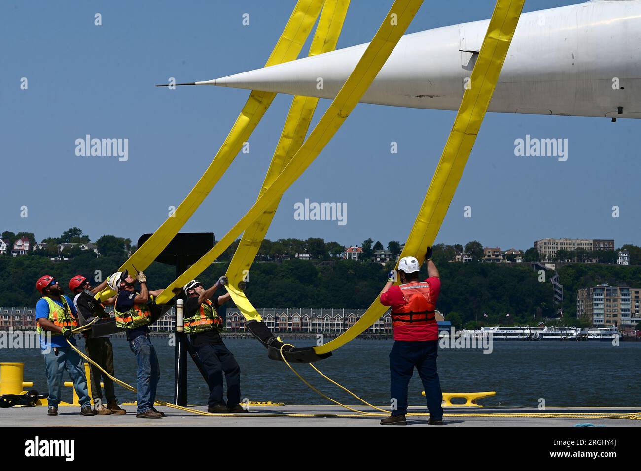New York, USA. 09th Aug, 2023. Workers remove harnesses from under the ...