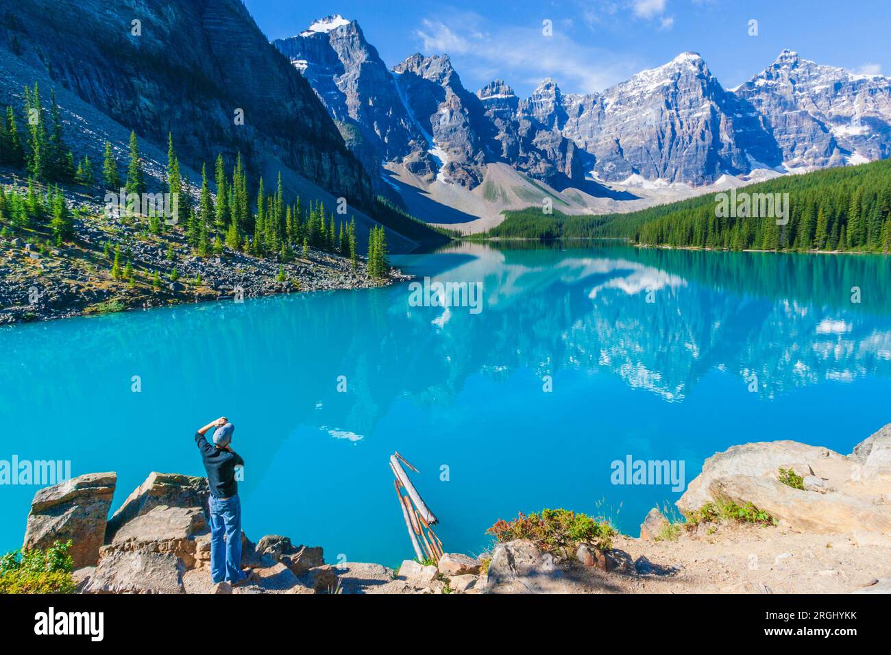 Photographer at Moraine Lake in Banff National Park, Alberta, Canada. Moraine Lake is a ...