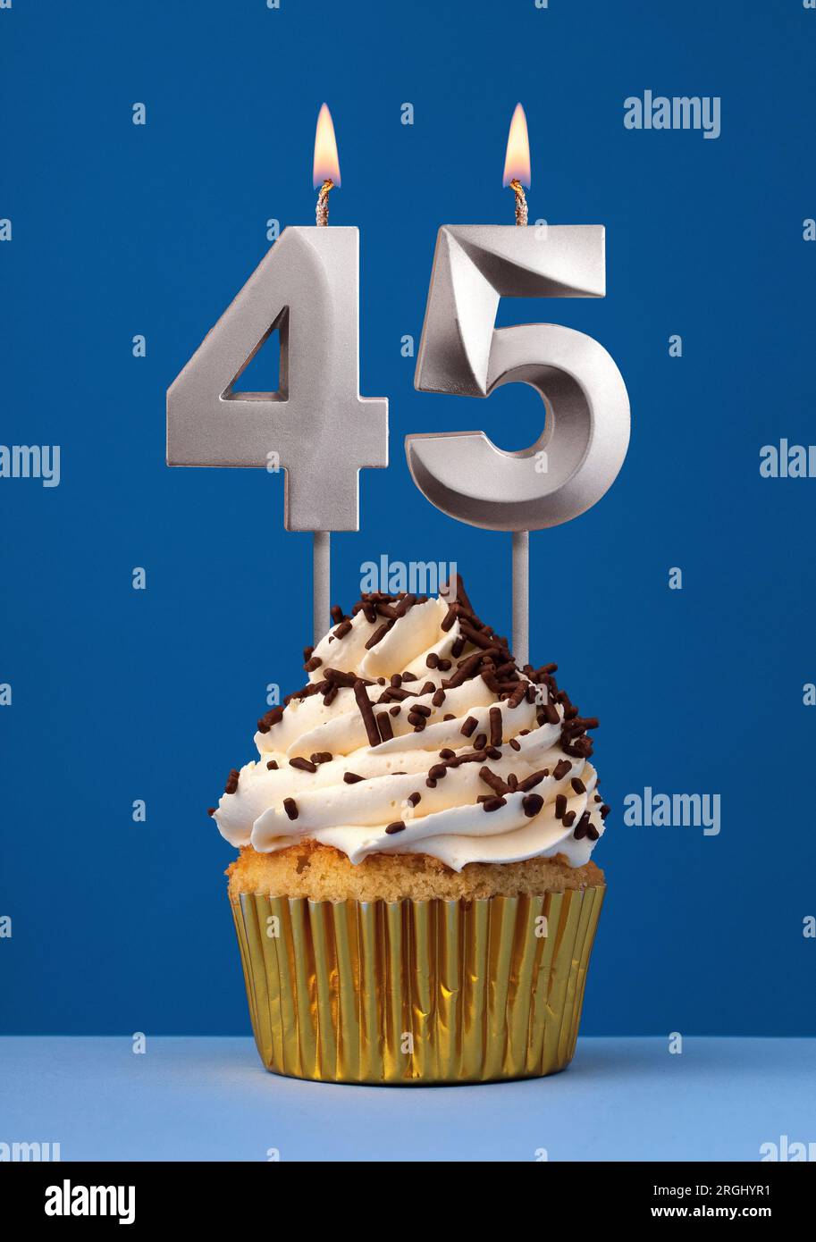 Burning candle number 45 - Birthday card with cake on blue Background ...