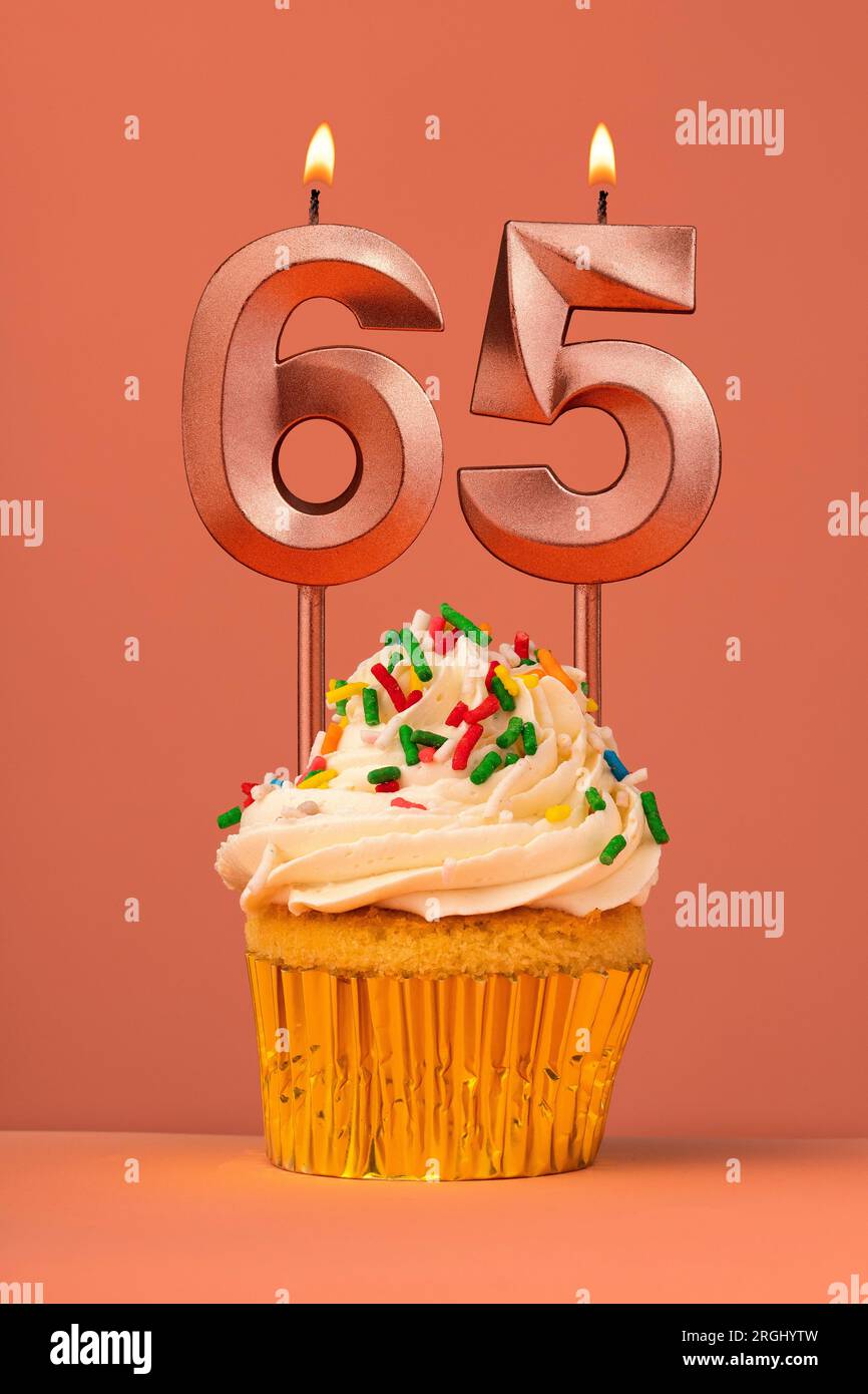 Birthday cake with candle number 65 - Coral fusion background Stock ...