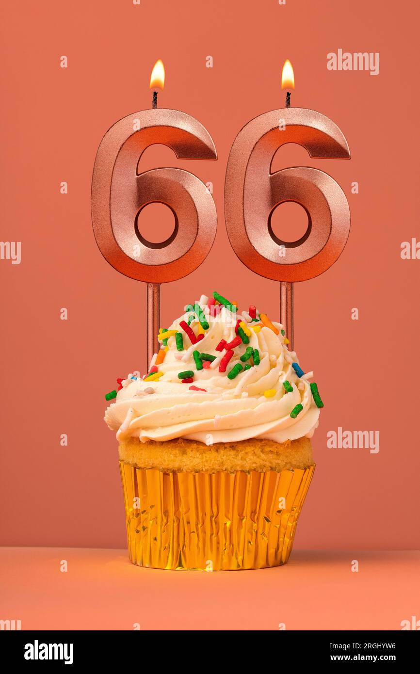 Candle number 66 - Cake birthday in coral fusion background Stock Photo ...