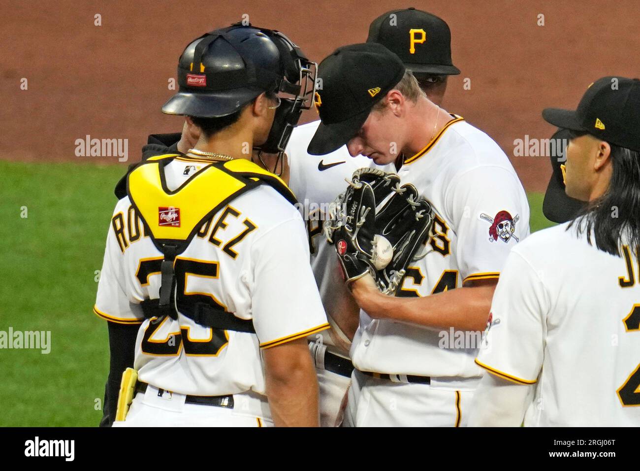 Pittsburgh Pirates starting pitcher Quinn Priester, center, waits on ...