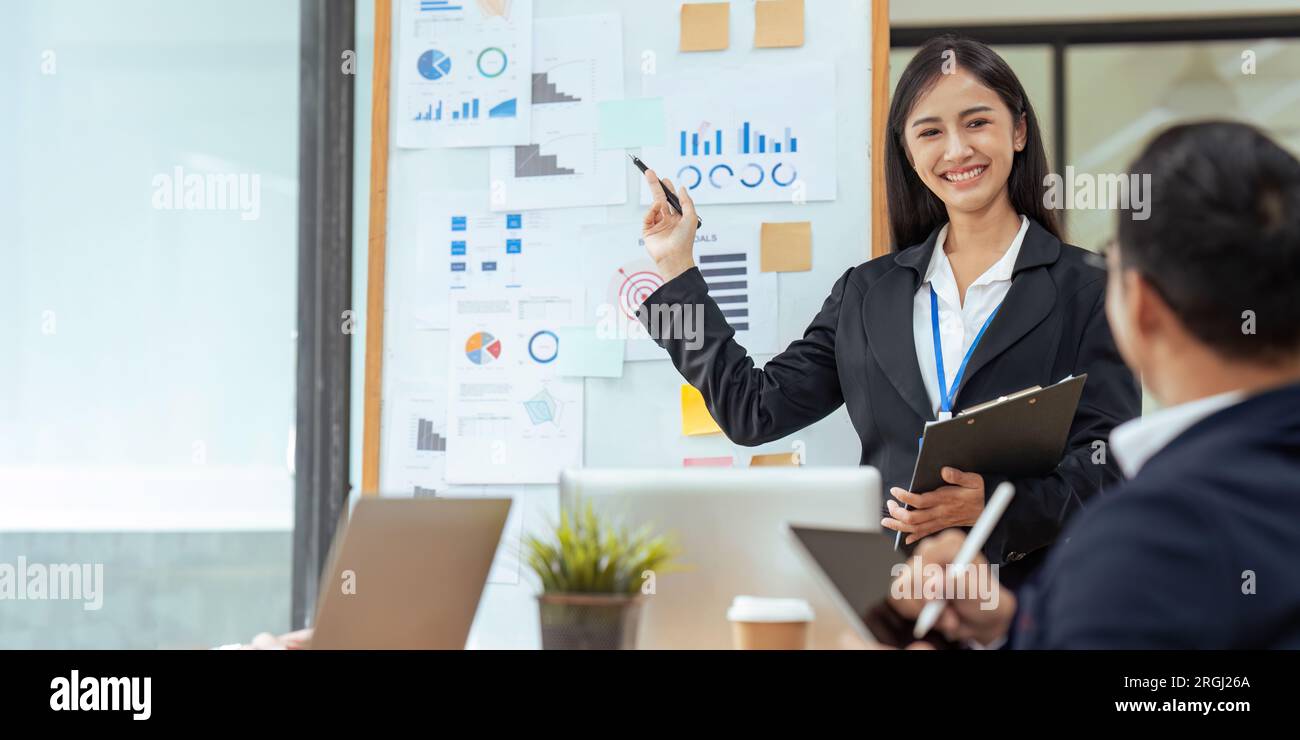Business woman present business strategy plan to corporate colleagues ...