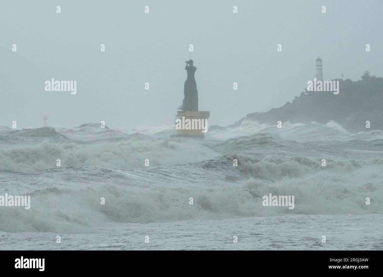 High waves crash a shore as the tropical storm named Khanun approaches ...