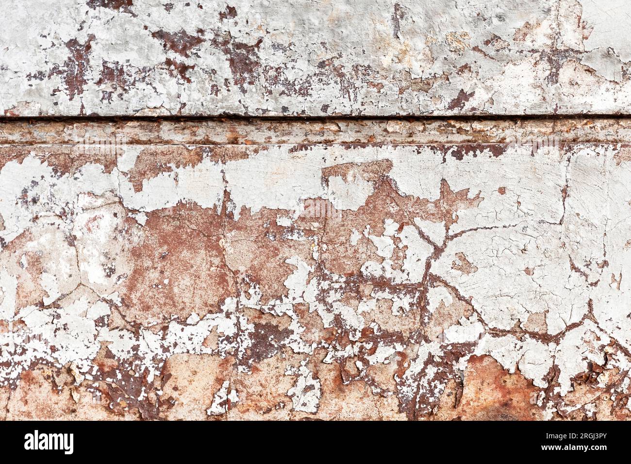 Concrete wall slowly deteriorating over time, displaying signs of decay ...