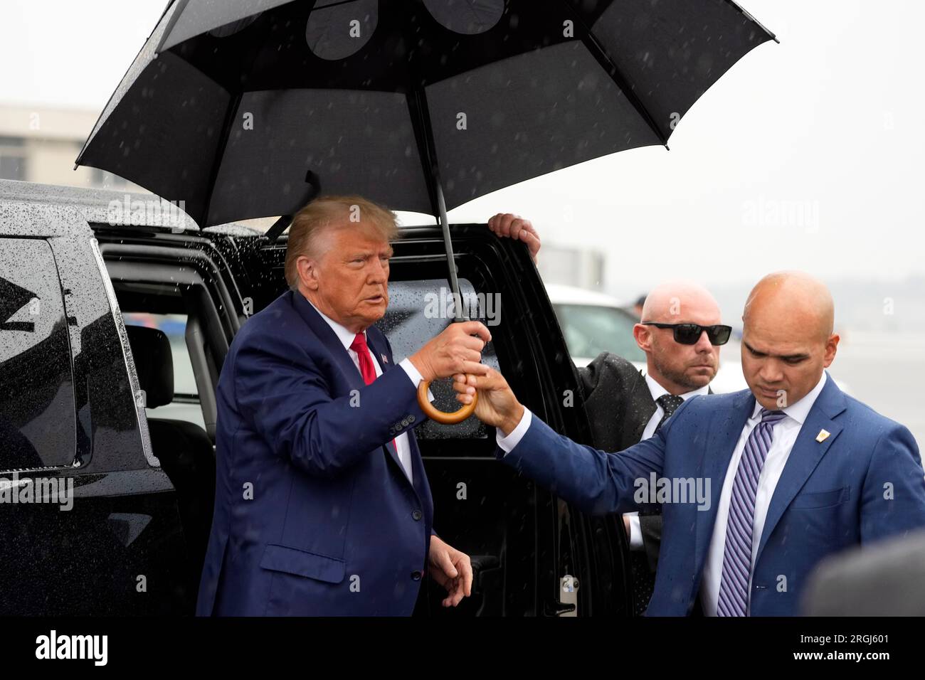 FILE - Valet Walt Nauta hands former President Donald Trump an umbrella ...