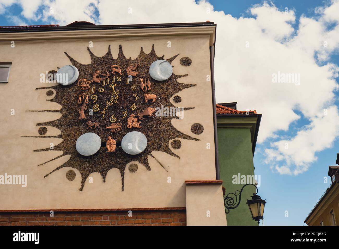 Warsaw Poland - May 2022 Clock with zodiac signs on the wall of a ...
