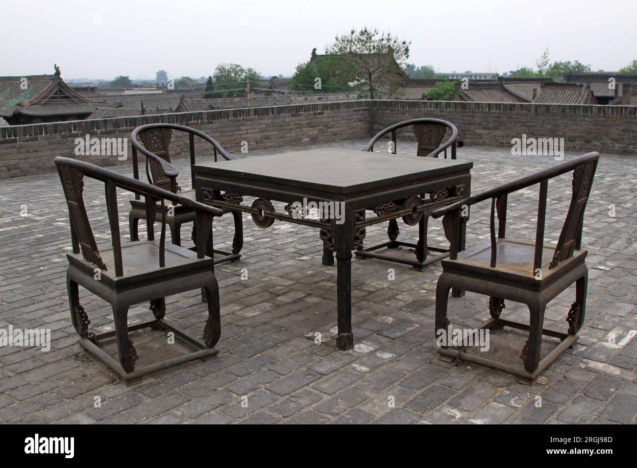 Desk and chair, the ancient city walls, having an antique flavour, have ...