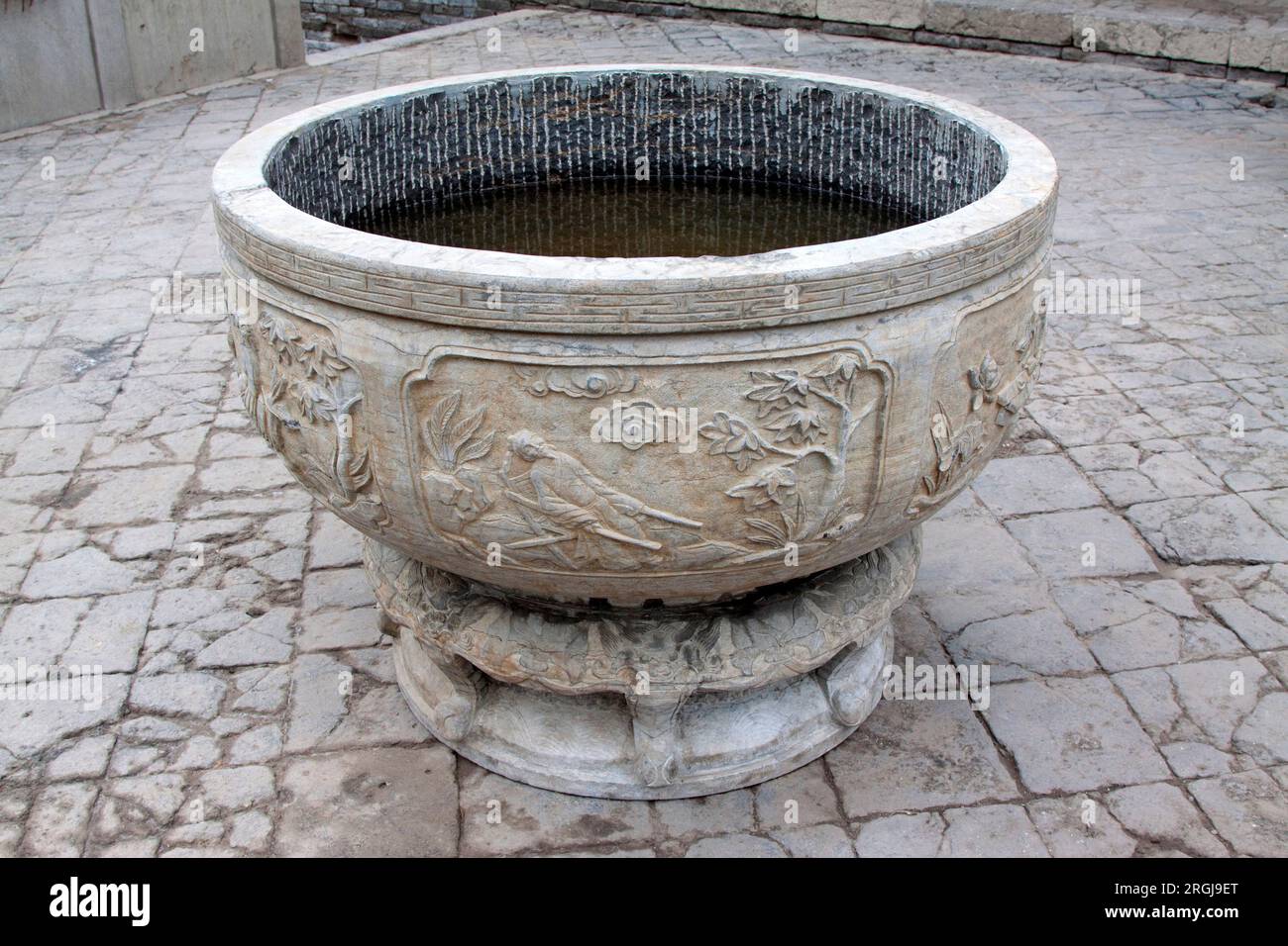 stone carving water tank crafts in the broken ground Stock Photo - Alamy