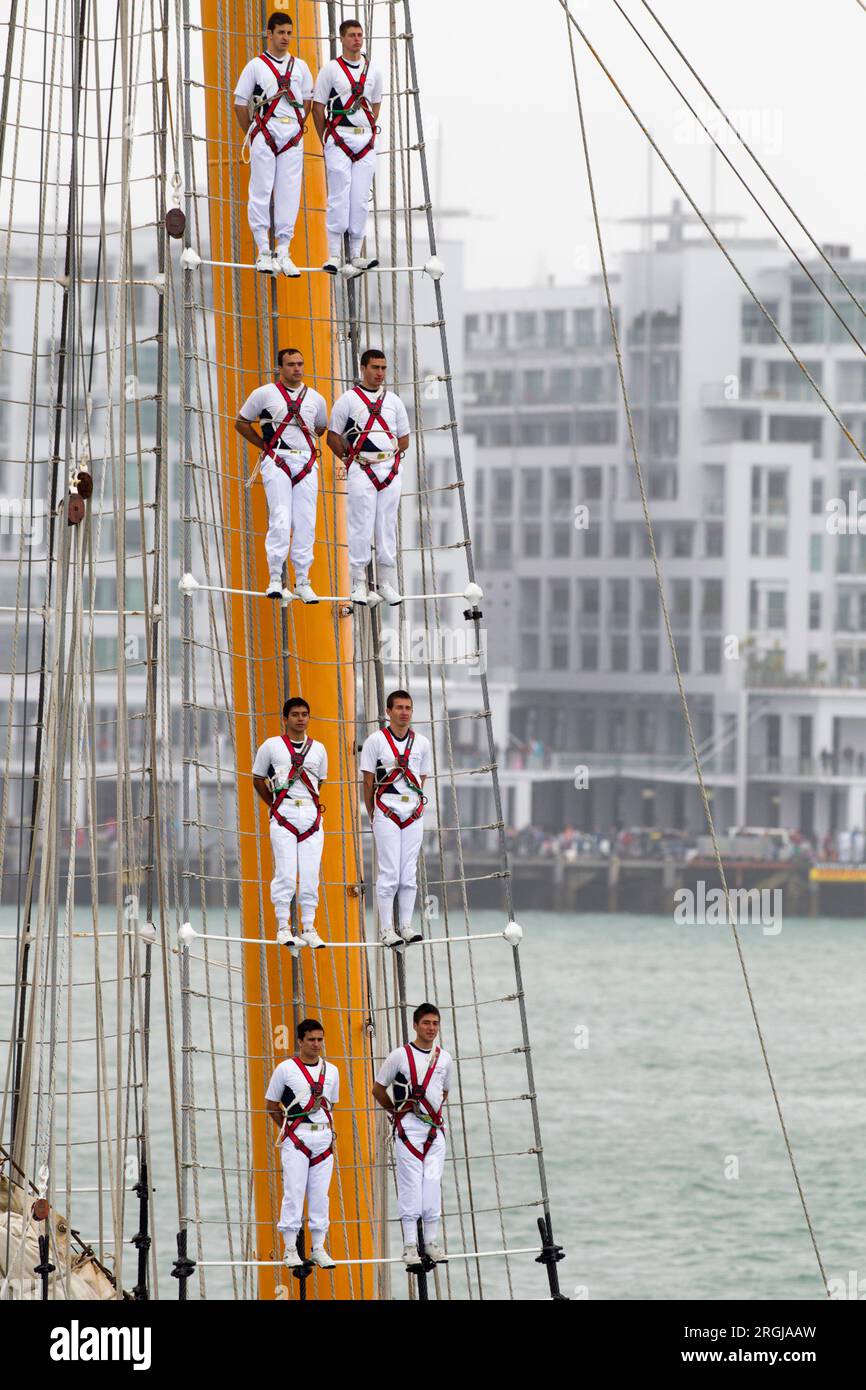 Sailors onboard and climb the masts of the Chilean Navy Ship, Esmeralda ...