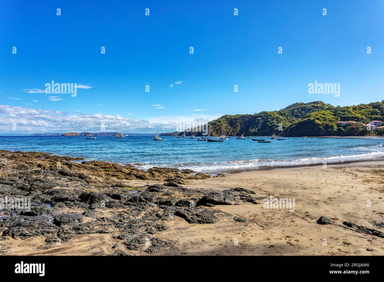 Playa Ocotal with Pacific ocean waves on rocky shore, El Coco Costa ...