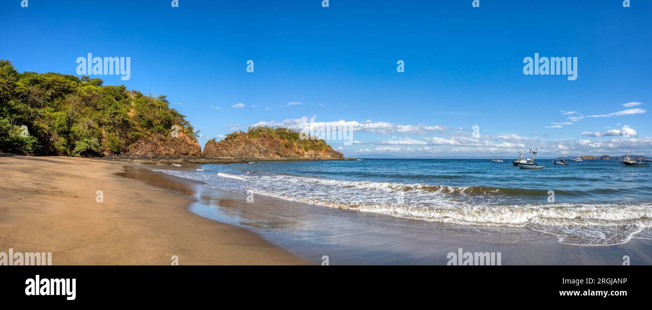 Playa Ocotal with Pacific ocean waves on rocky shore, El Coco Costa ...