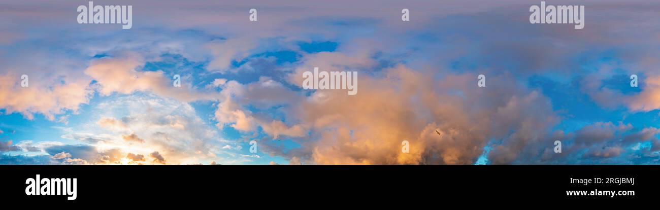 Sunset sky panorama with dramatic bright glowing pink Cumulus clouds ...