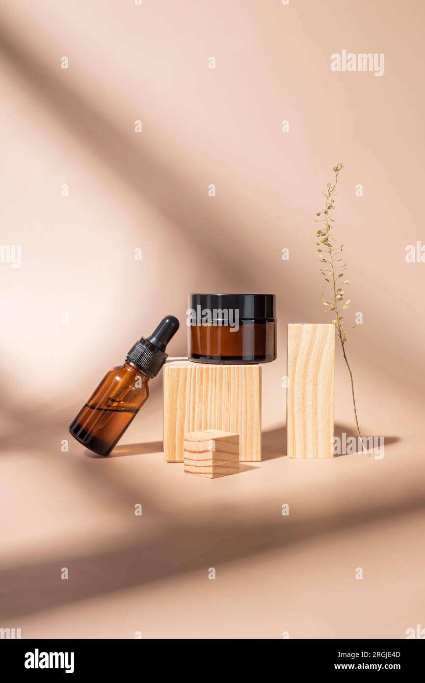 Set of cosmetic products in amber glass package. Beauty oil in droppper ...