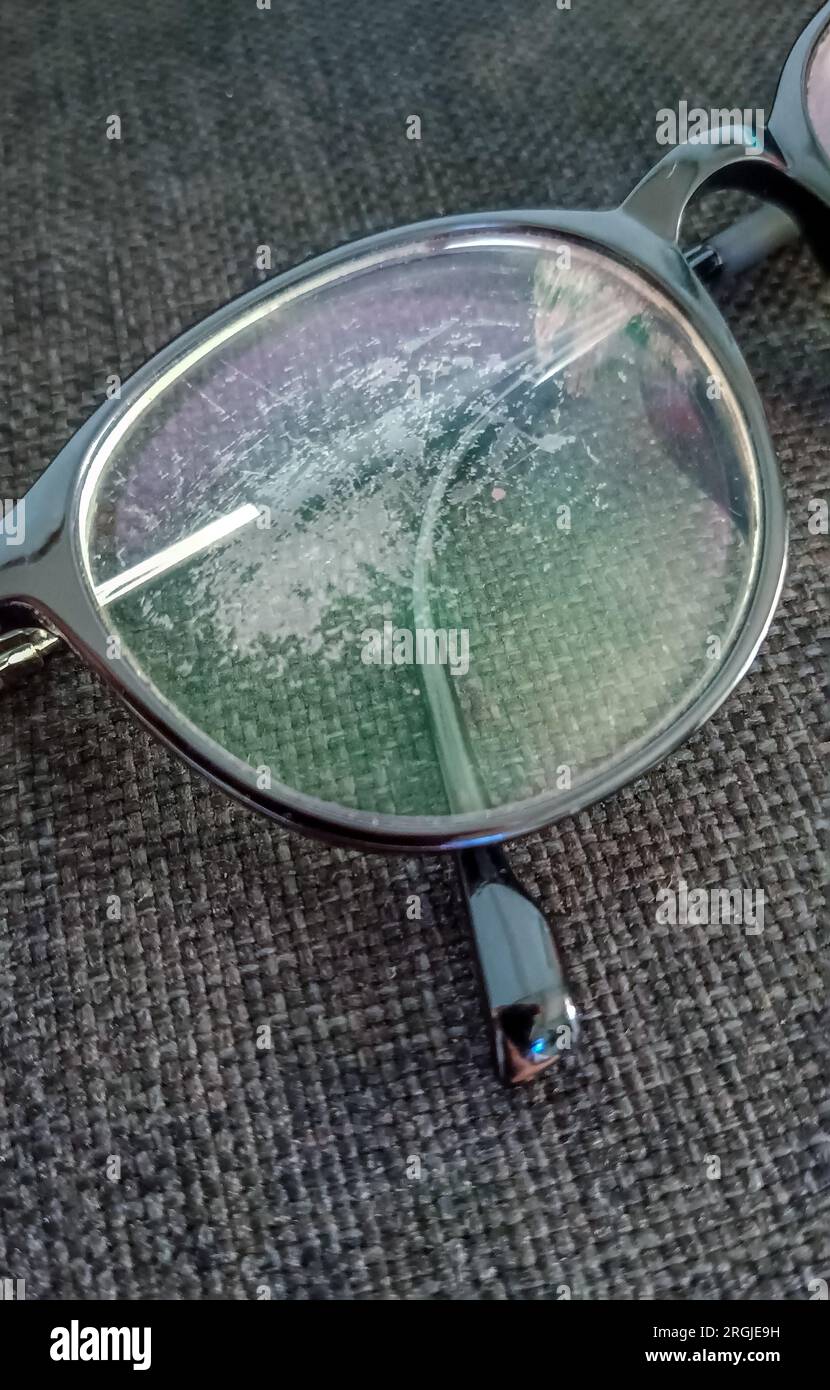 Glasses with black frames with scratched and stained lenses Stock Photo ...