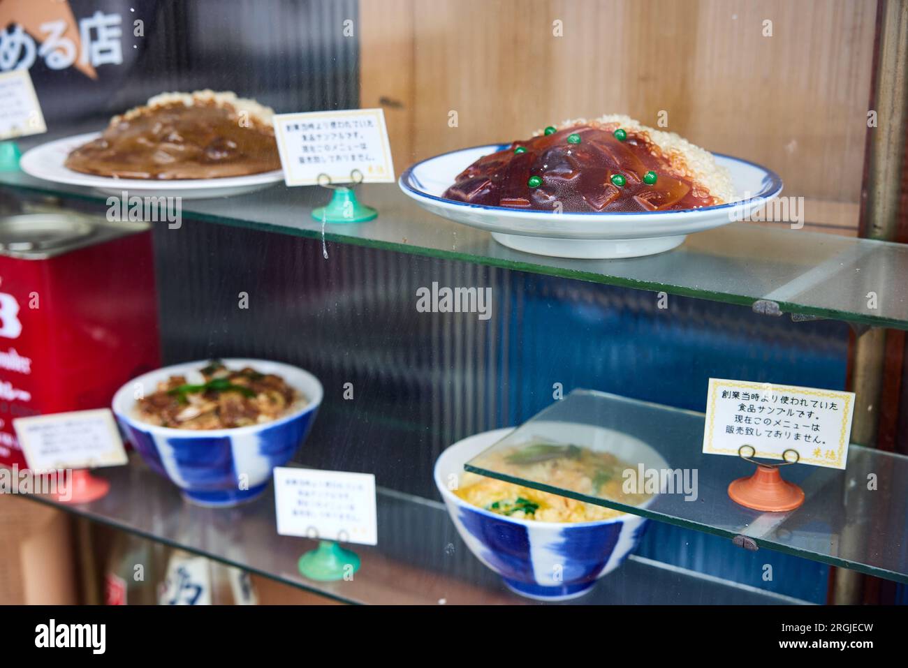 Plastic food models (shokuhin sampuru) in glass cabinet outside ...