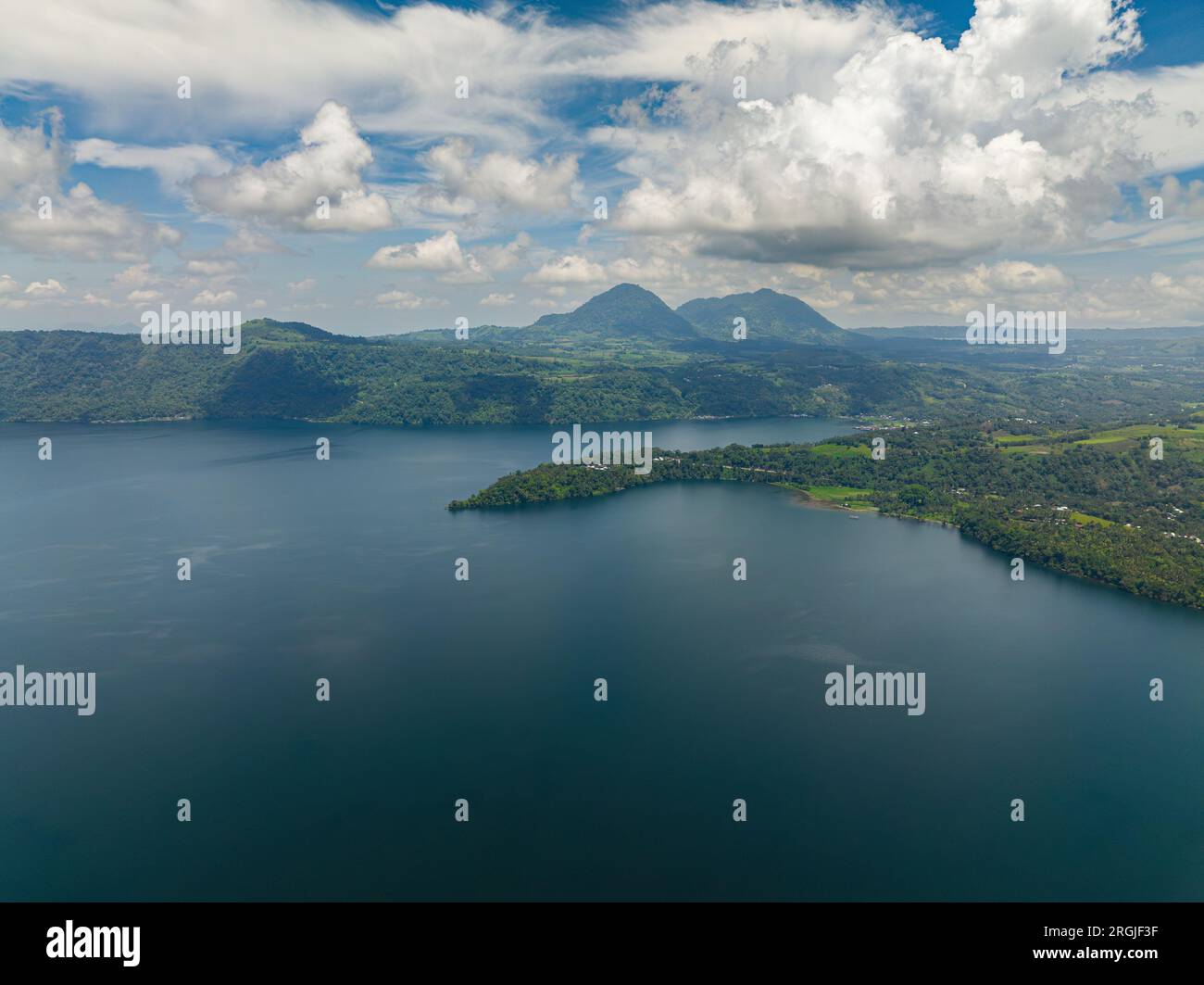 Lake Lanao and mountain with green forest. Blue sky and clouds ...