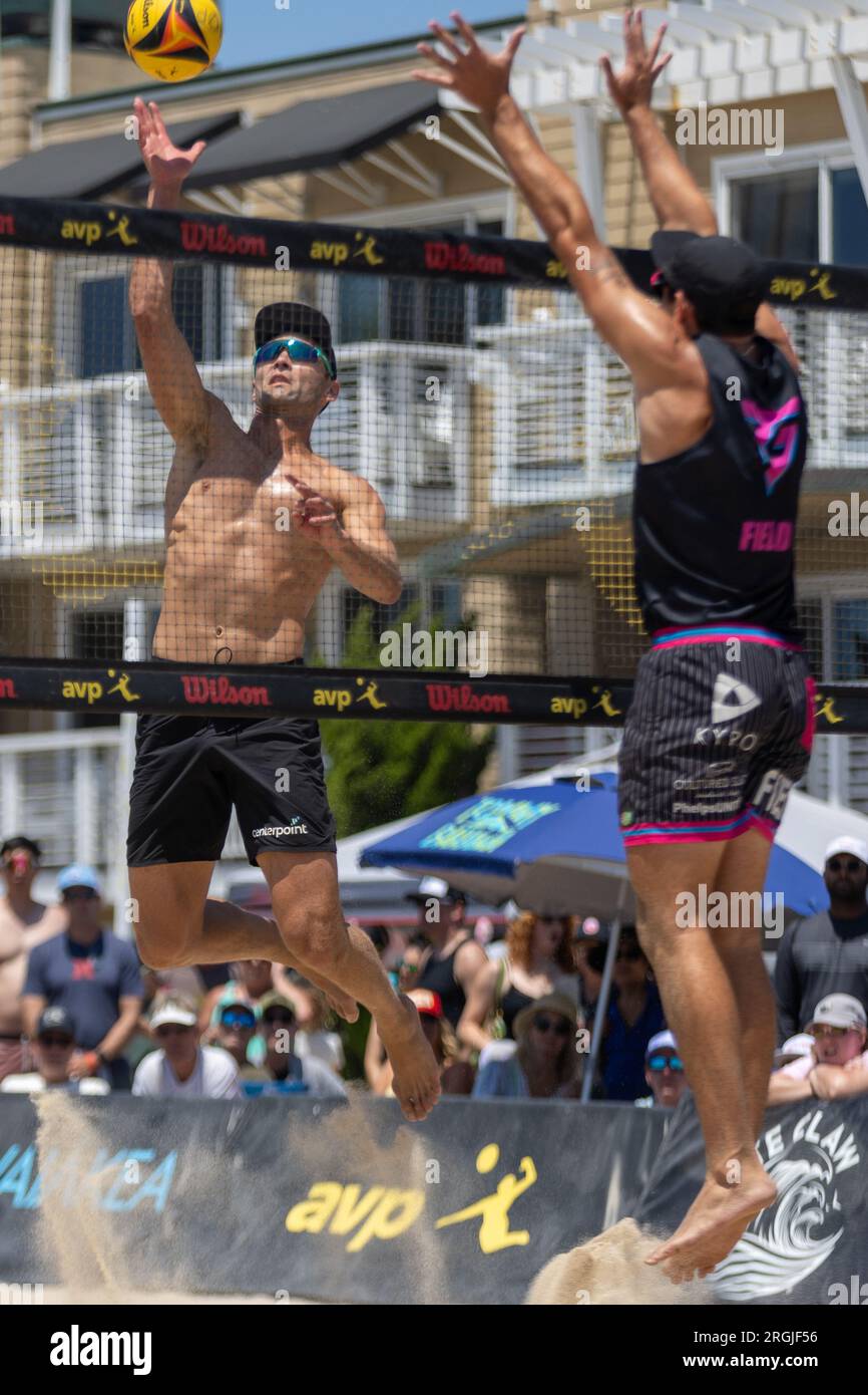 Paul Lotman hits away from the block of Troy Field during the AVP ...