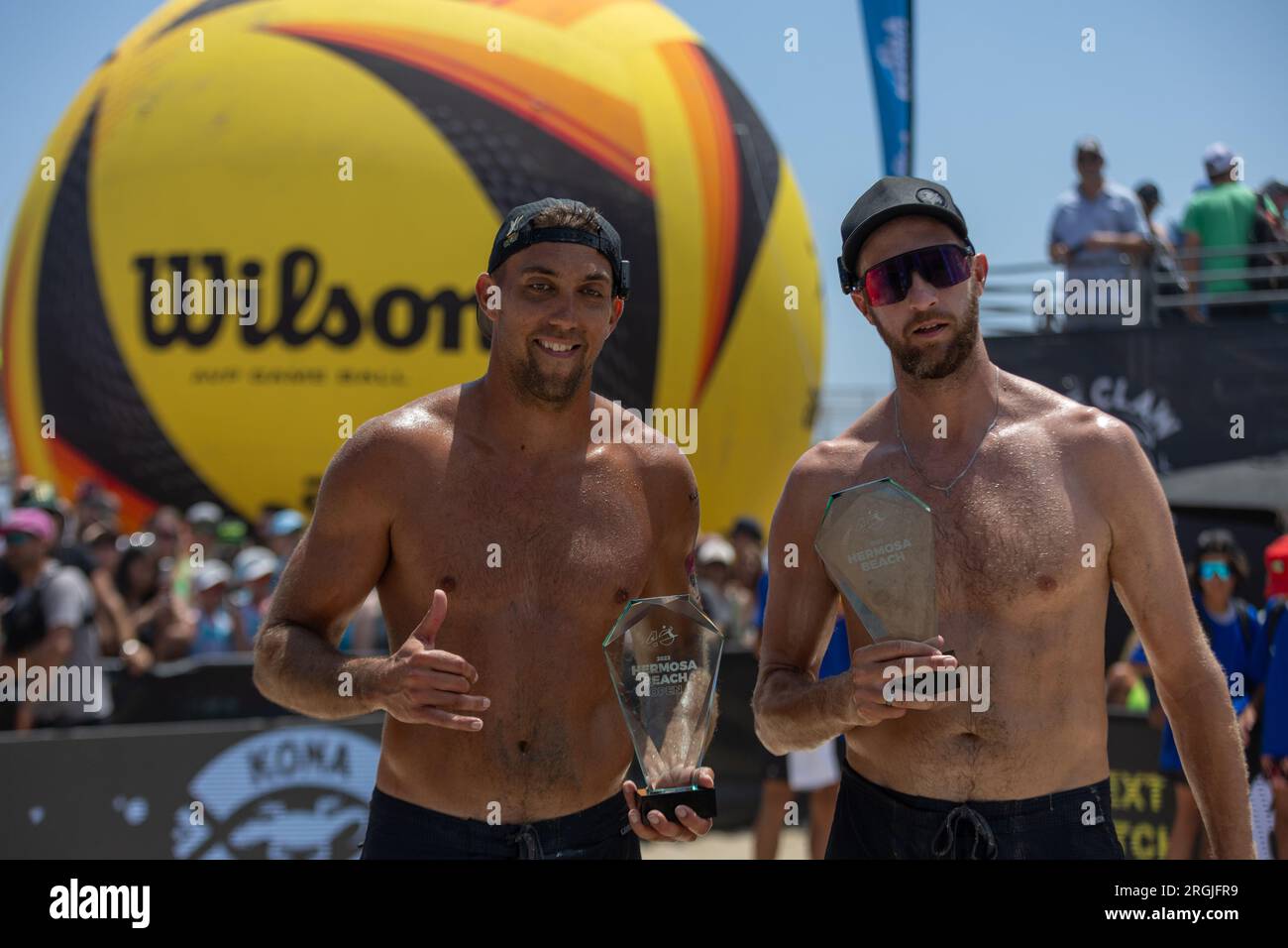 Trevor Crabb and Theo Brunner pose with their championship trophies at ...