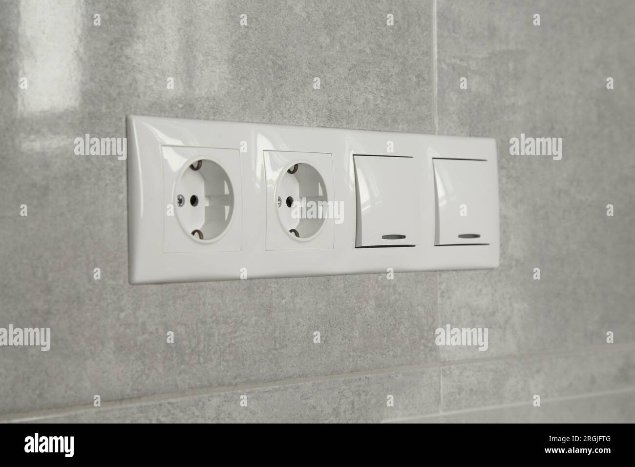 Light switches and power sockets on wall indoors Stock Photo - Alamy
