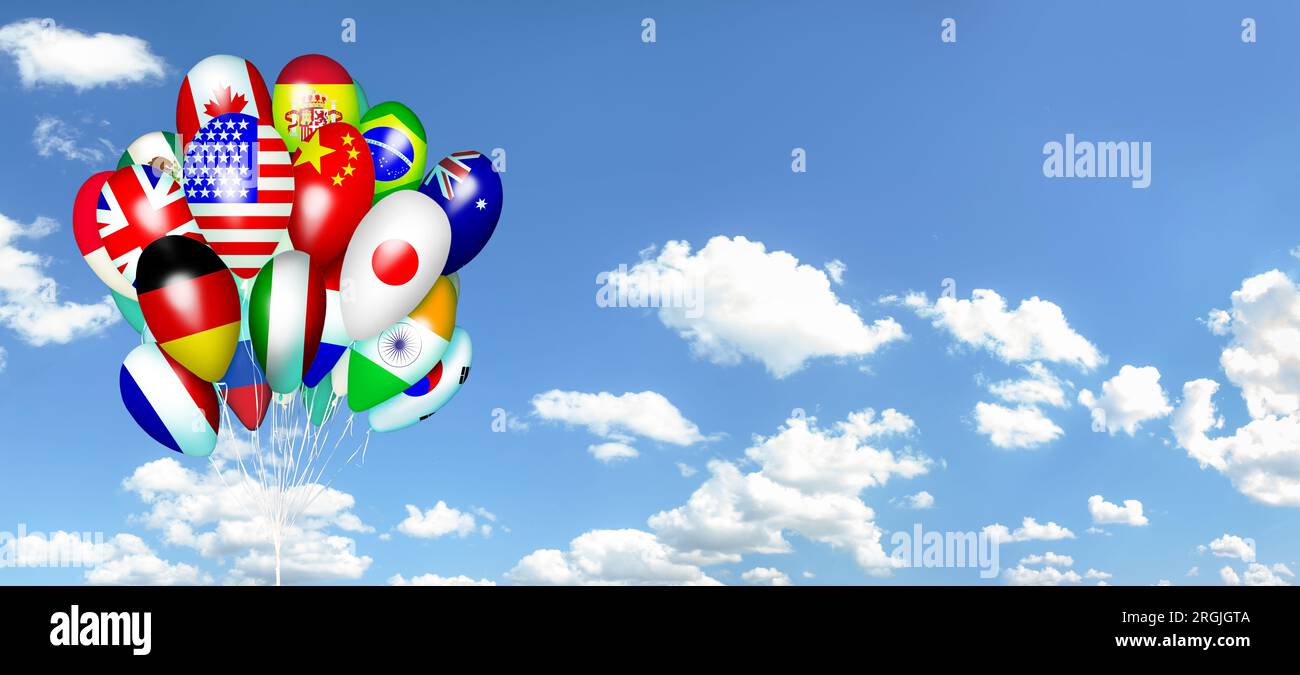 Balloons with countries flags against panoramic blue sky with clouds ...
