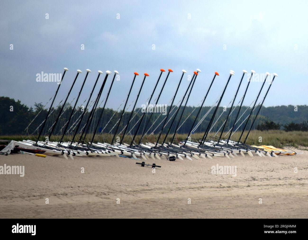 Beached catamarans in a line Stock Photo - Alamy